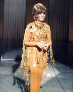 Dusty Springfield rocked a Blonde Wig and a Column Dress