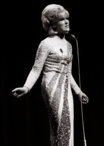 Dusty Springfield rocked a Blonde Wig and a Column Dress